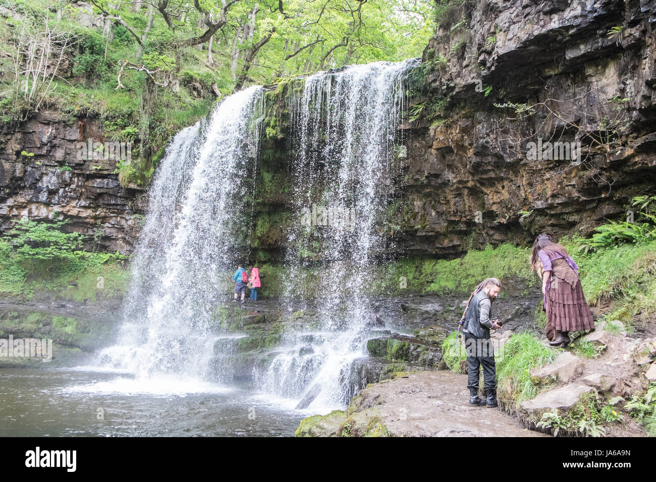 People,hiking,walk,behind,beneath,waterfall,Sgwd yr Eira,Waterfall of ...