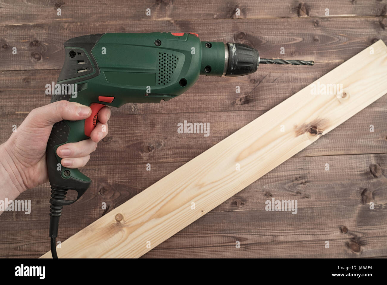 Electrical Drill in hand Stock Photo - Alamy