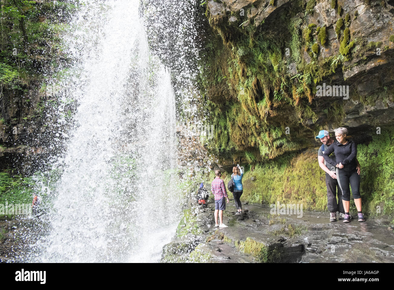 People,hiking,walk,behind,beneath,waterfall,Sgwd yr Eira,Waterfall of ...