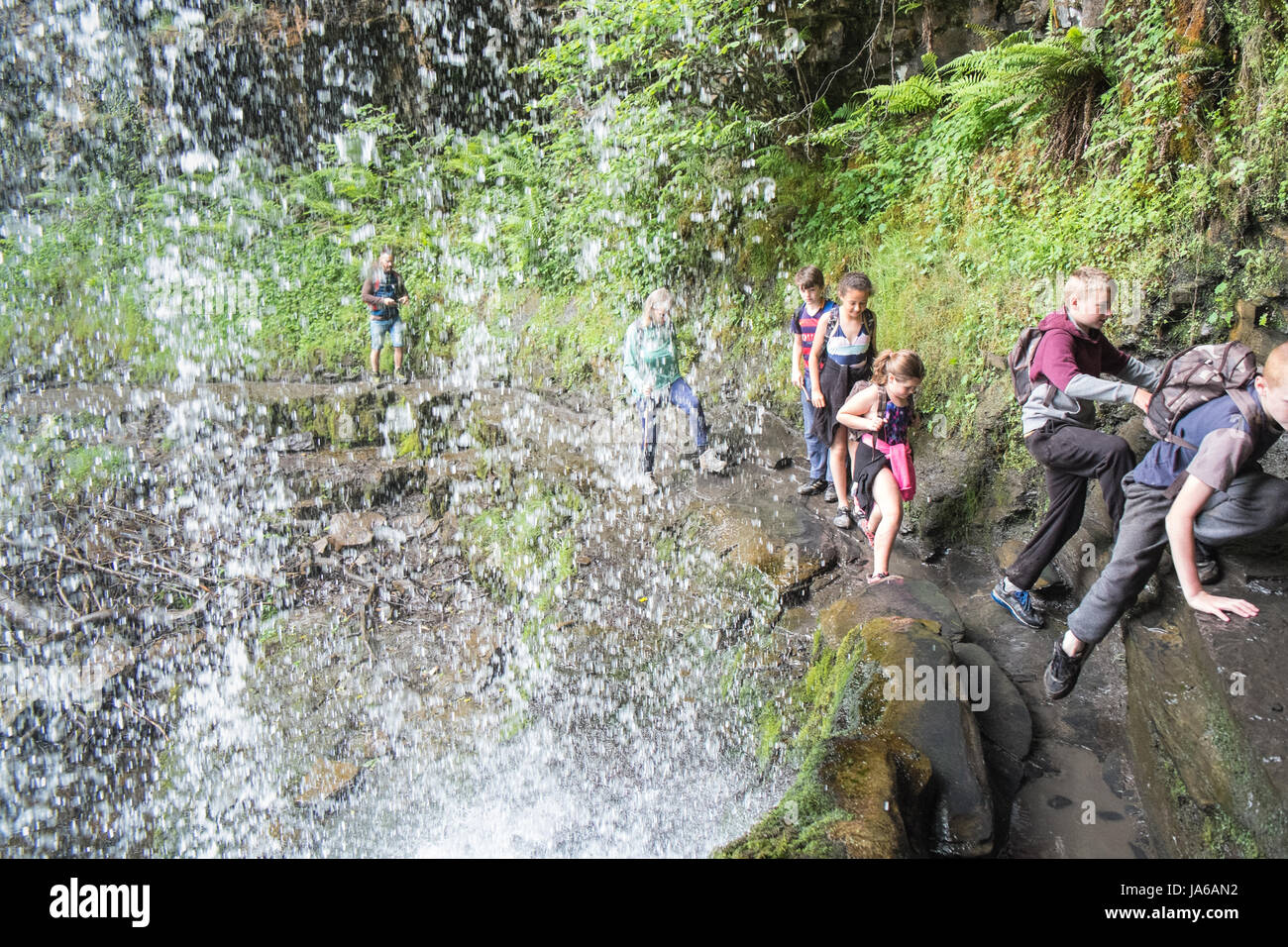 People,hiking,walk,behind,beneath,waterfall,Sgwd yr Eira,Waterfall of ...