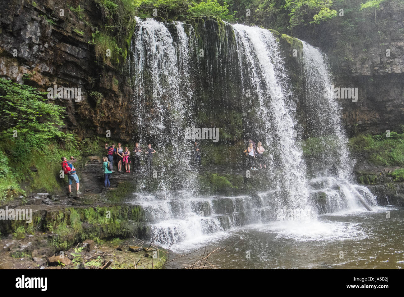 People,hiking,walk,behind,beneath,waterfall,Sgwd yr Eira,Waterfall of ...