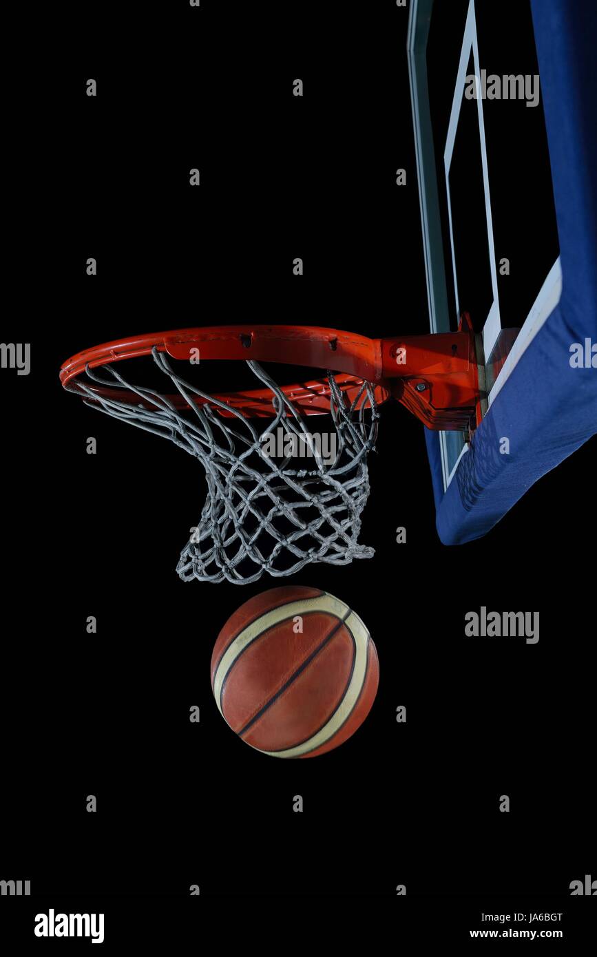 Basketball ball, board and net on black background in gym indoor Stock ...