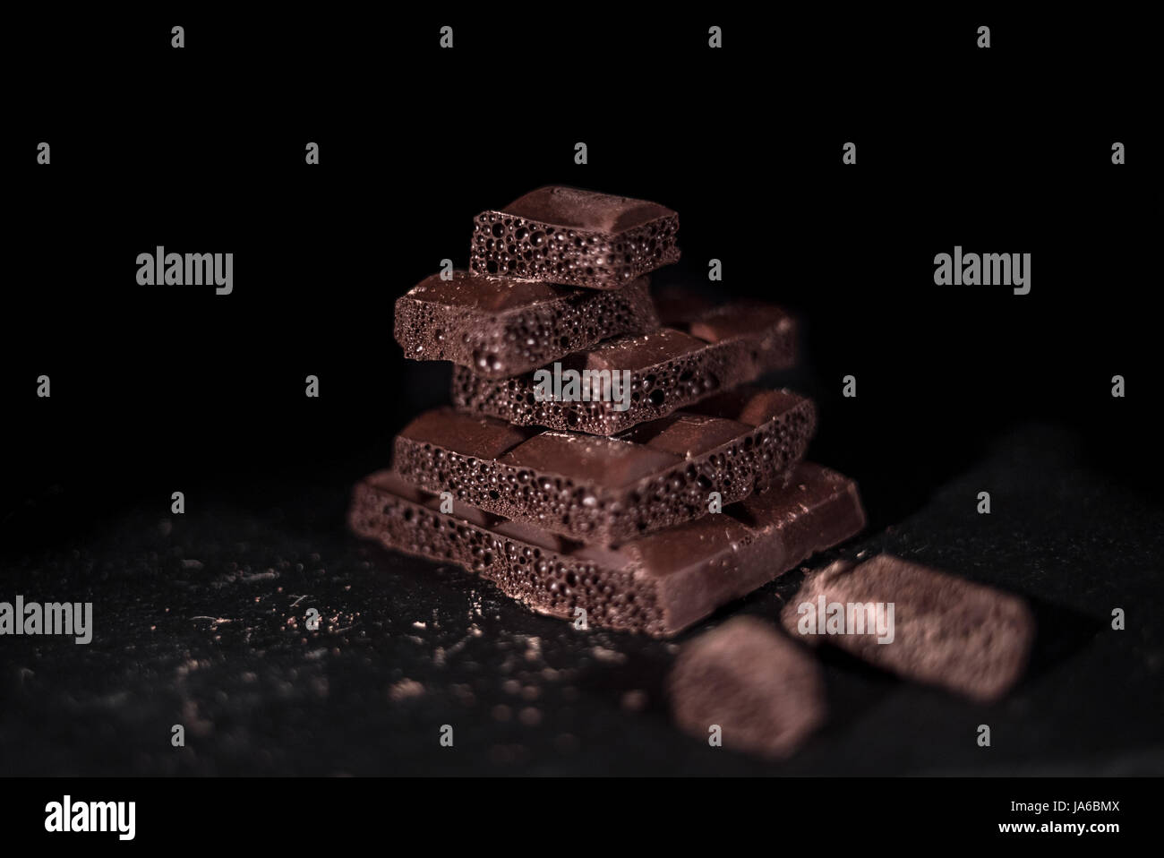 Stack of black pore chocolate Stock Photo - Alamy