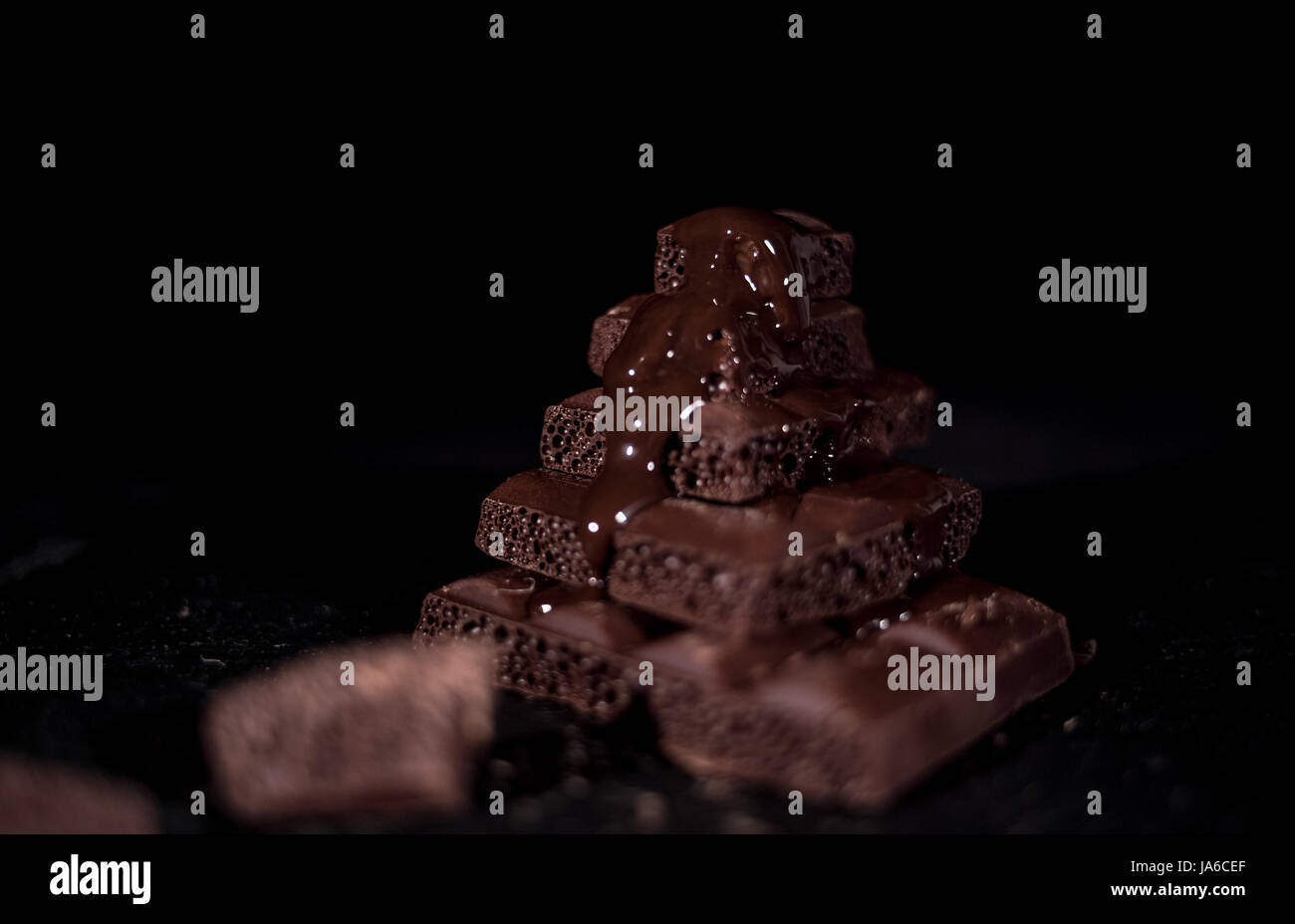 Stack of black pore chocolate Stock Photo - Alamy