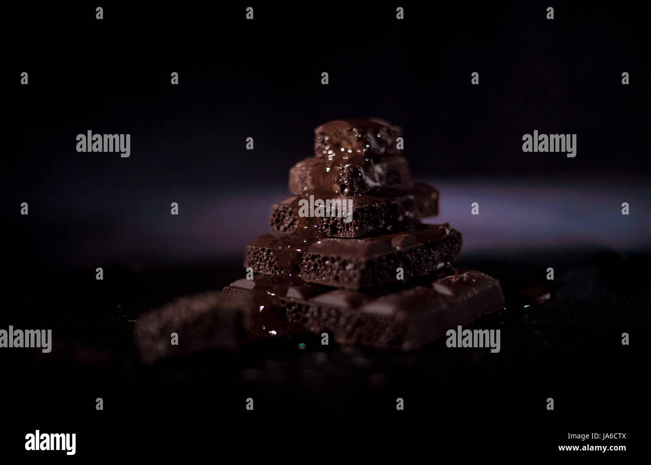 Stack of black pore chocolate Stock Photo - Alamy