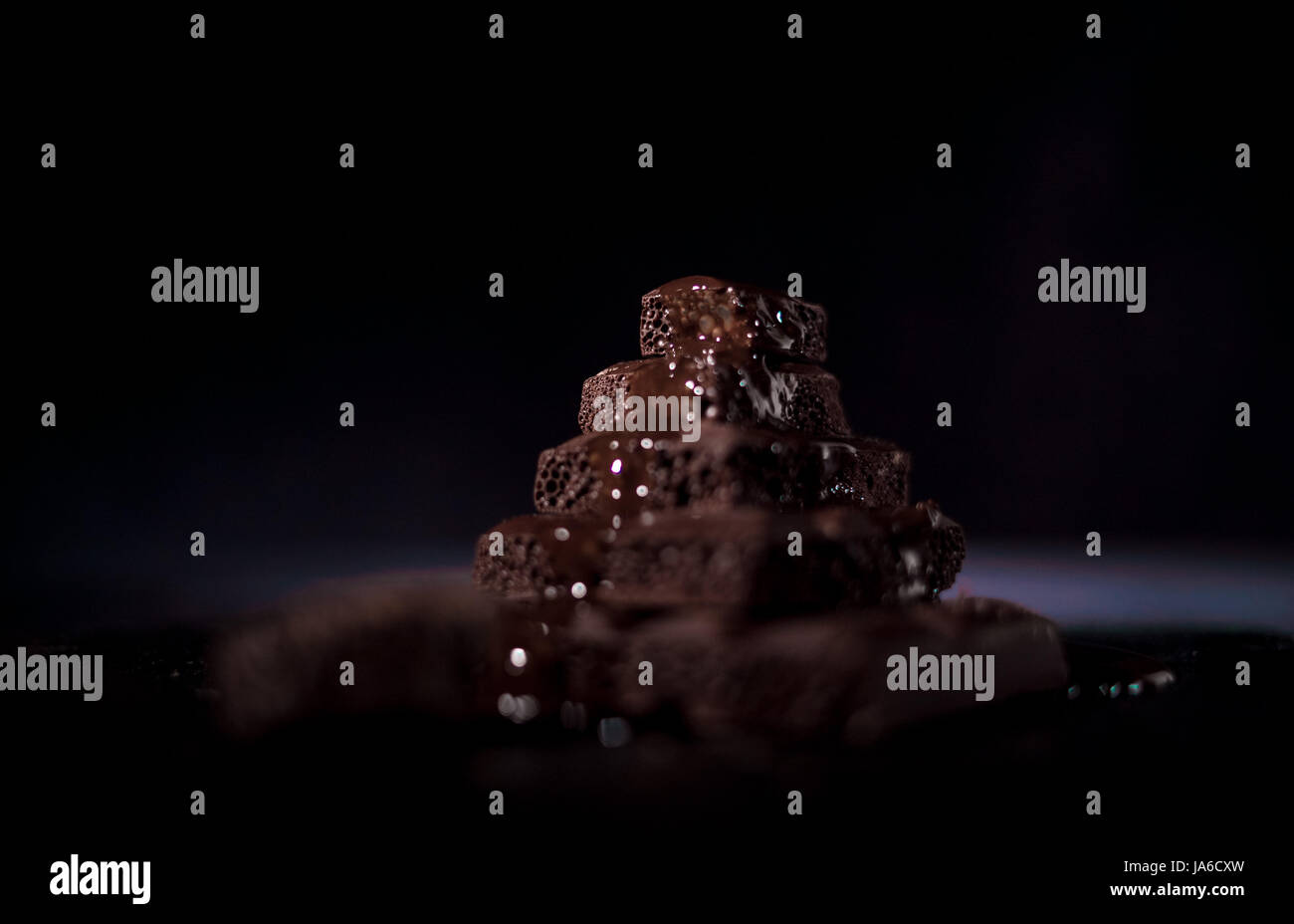 Stack of black pore chocolate Stock Photo - Alamy
