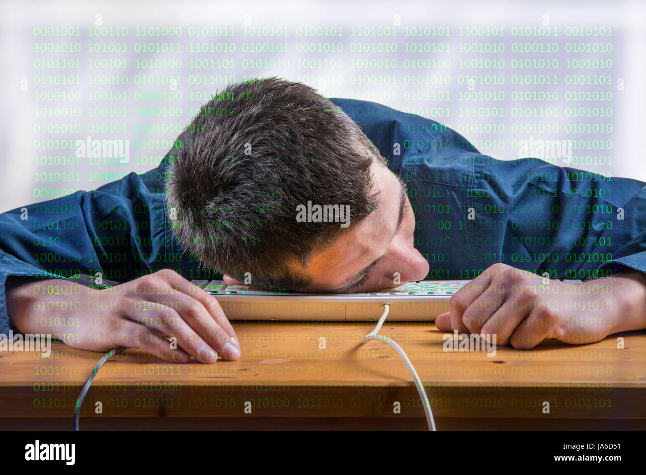 young man sleeping on the computer, sleeping on work Stock Photo - Alamy
