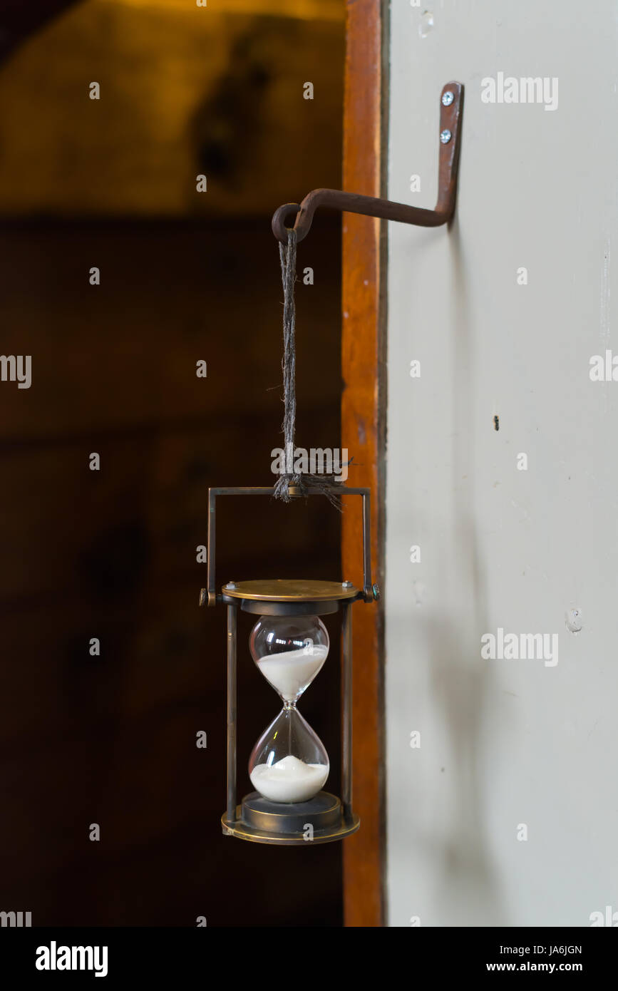 antique hourglass on an old sailboat Stock Photo - Alamy