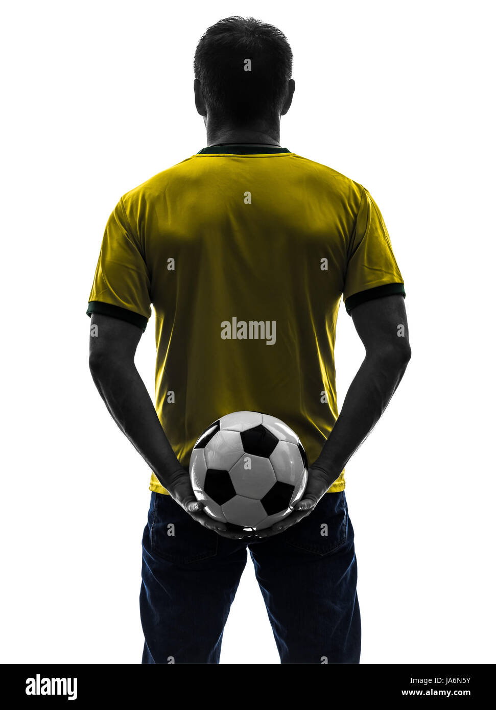 one caucasian man holding soccer football silhouette rear view back in ...