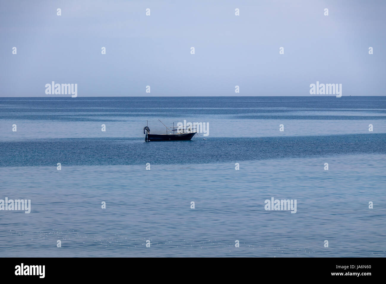 A boat in a Mediterranean beach of Ionian Sea - Bova Marina, Calabria ...
