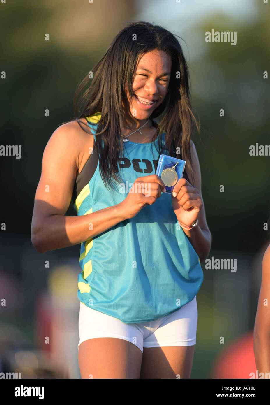 Ariyonna Augustine of Long Beach Poly poses with medal after winning ...