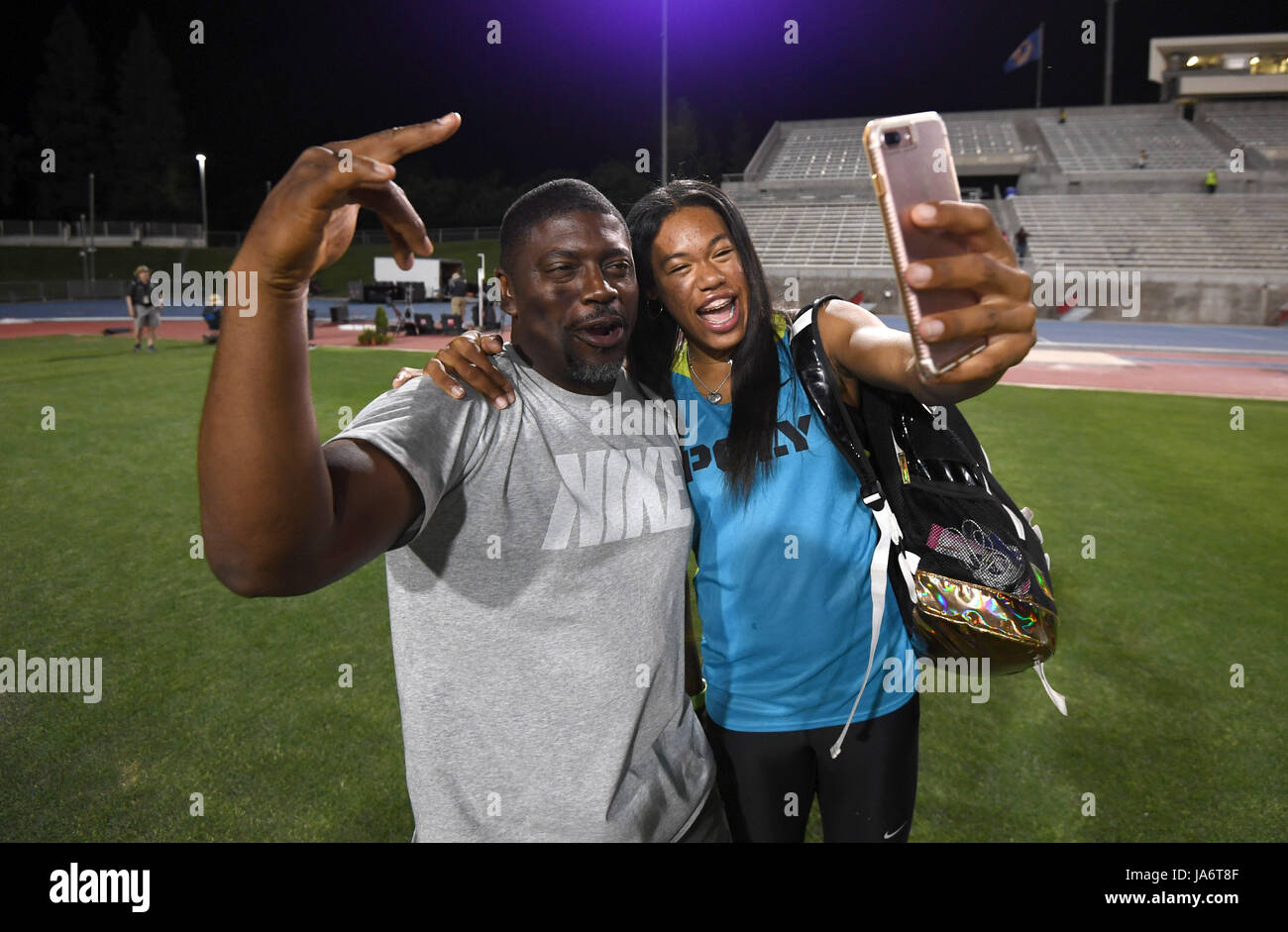 Ariyonna Augustine (right) poses with Poly sprints coach Doc Moye after ...