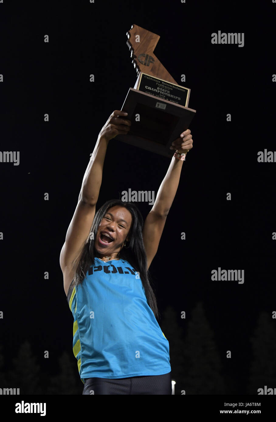 Ariyonna Augustine of Long Beach Poly poses with the girls team ...