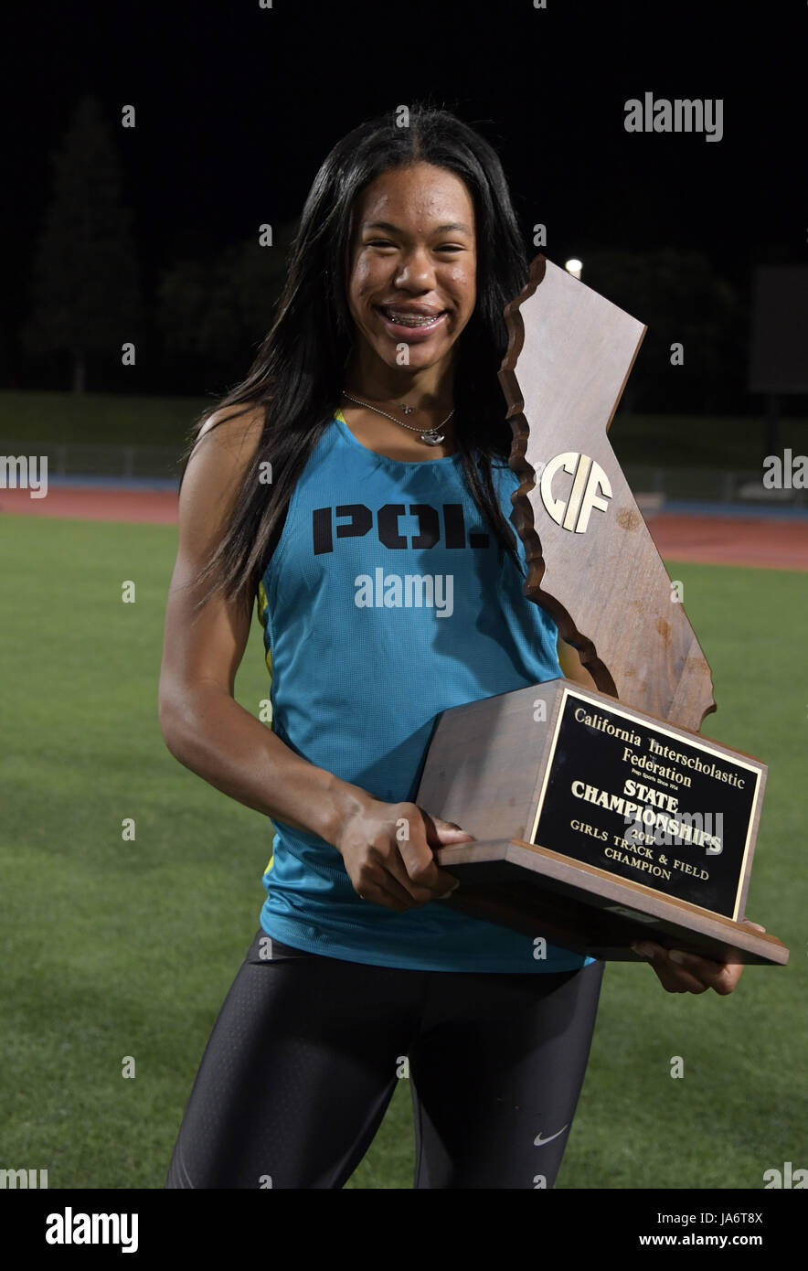 Ariyonna Augustine of Long Beach Poly poses with the girls team ...