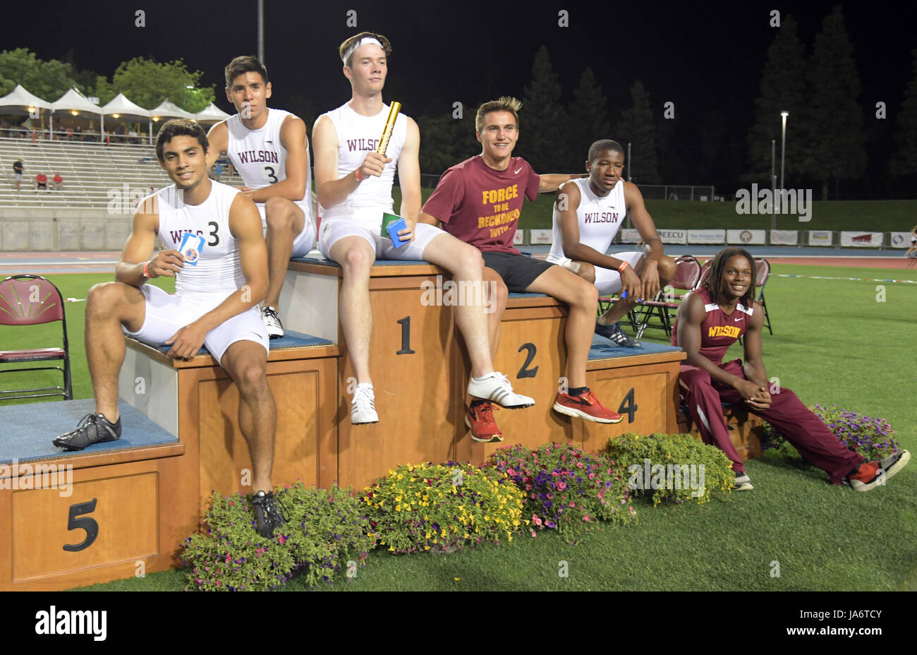 Members of the Long Beach Wilson 4 x 400m relay pose after placing ...
