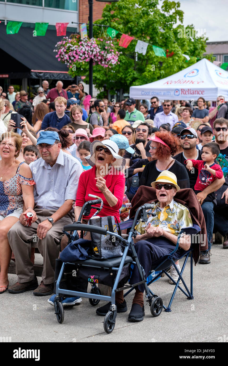 Old age elderly couple having fun at a music festival, male and female ...