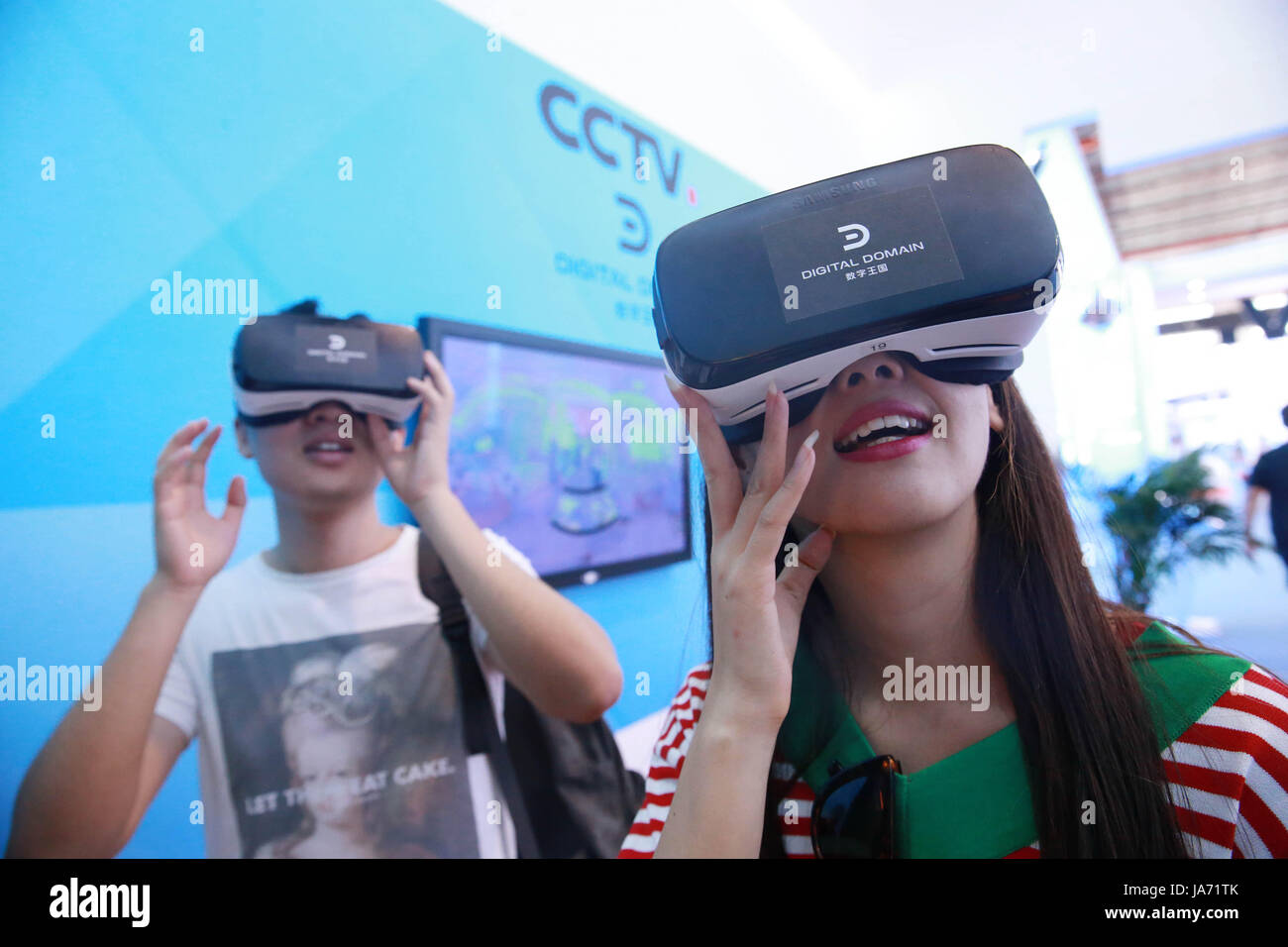 Beijing, China. 24th Aug, 2017. Visitors experience Virtual Reality (VR ...