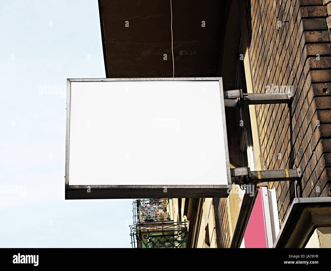 Signboard side view of empty white mock up signage in black, grey frame ...