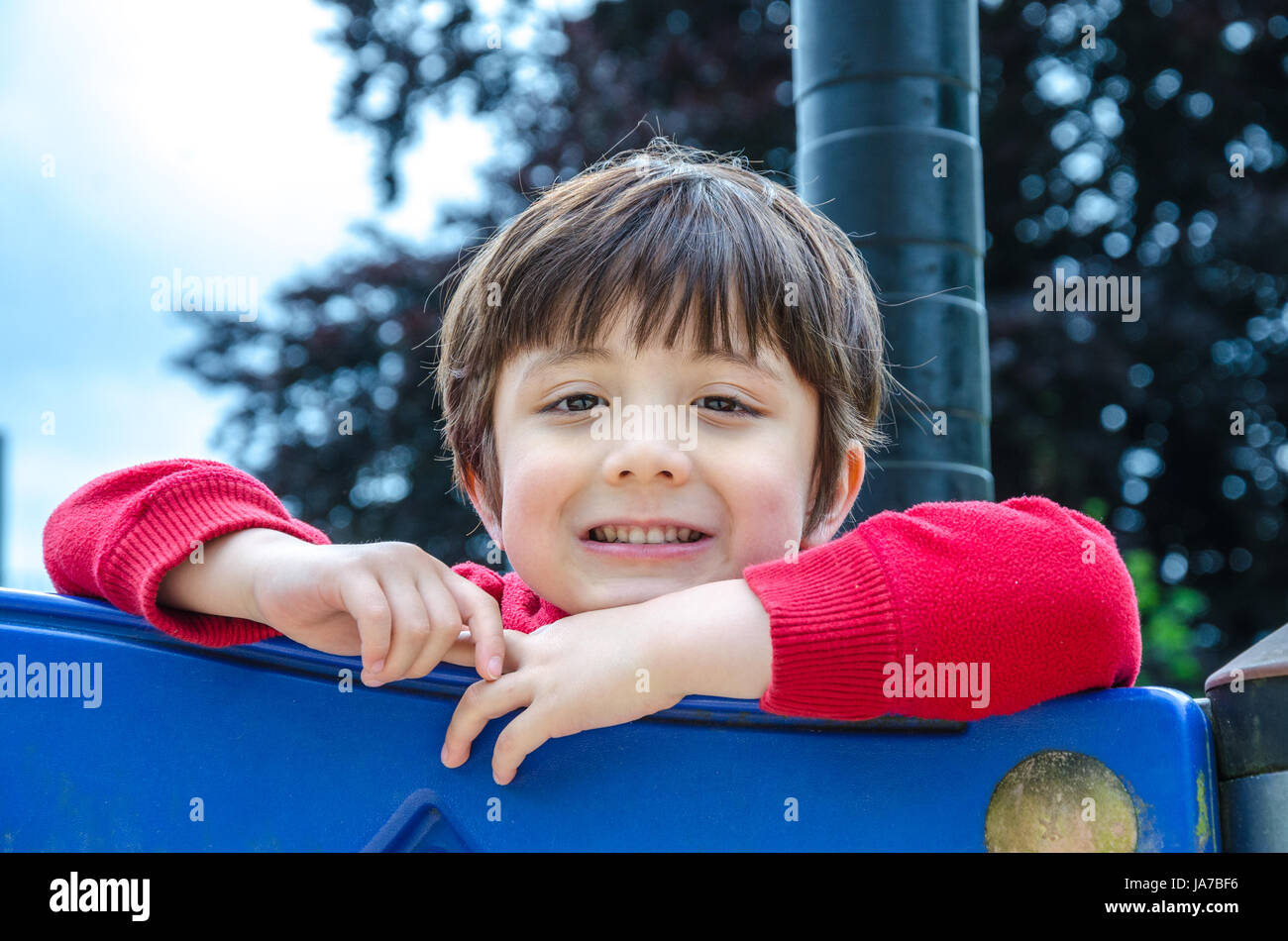 A young child playing in the children's playground in Prspect Park ...