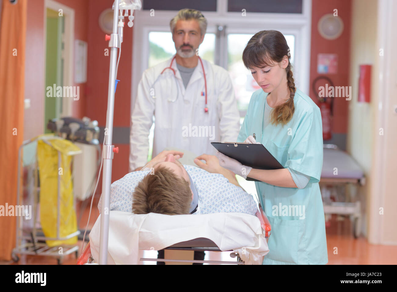 doctors transporting a patient to surgery Stock Photo - Alamy
