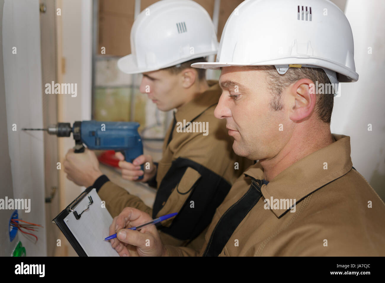 trainee electrician learning his trade Stock Photo - Alamy