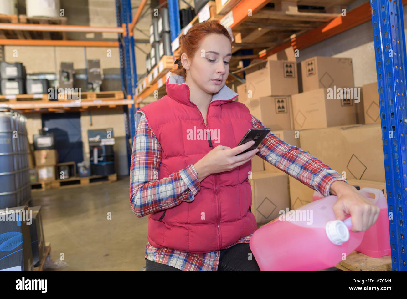 employee reading a message from the cellular phone Stock Photo - Alamy