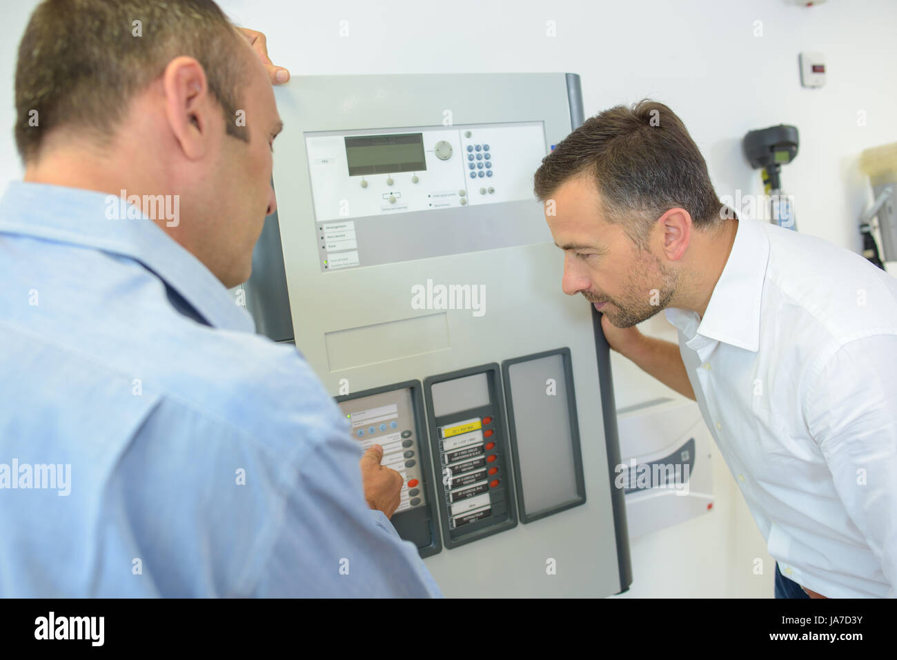 engineers checking device Stock Photo - Alamy