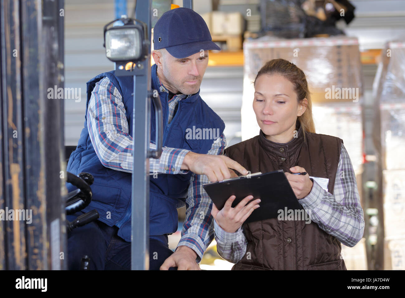 Forklift driver talking manager hi-res stock photography and images - Alamy