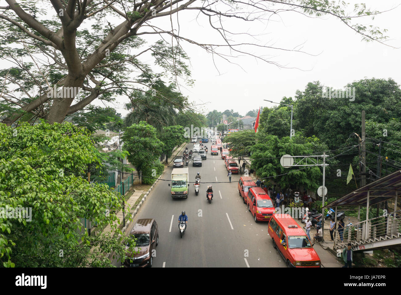 Traffic condition in main street with public transporation at Jakarta ...