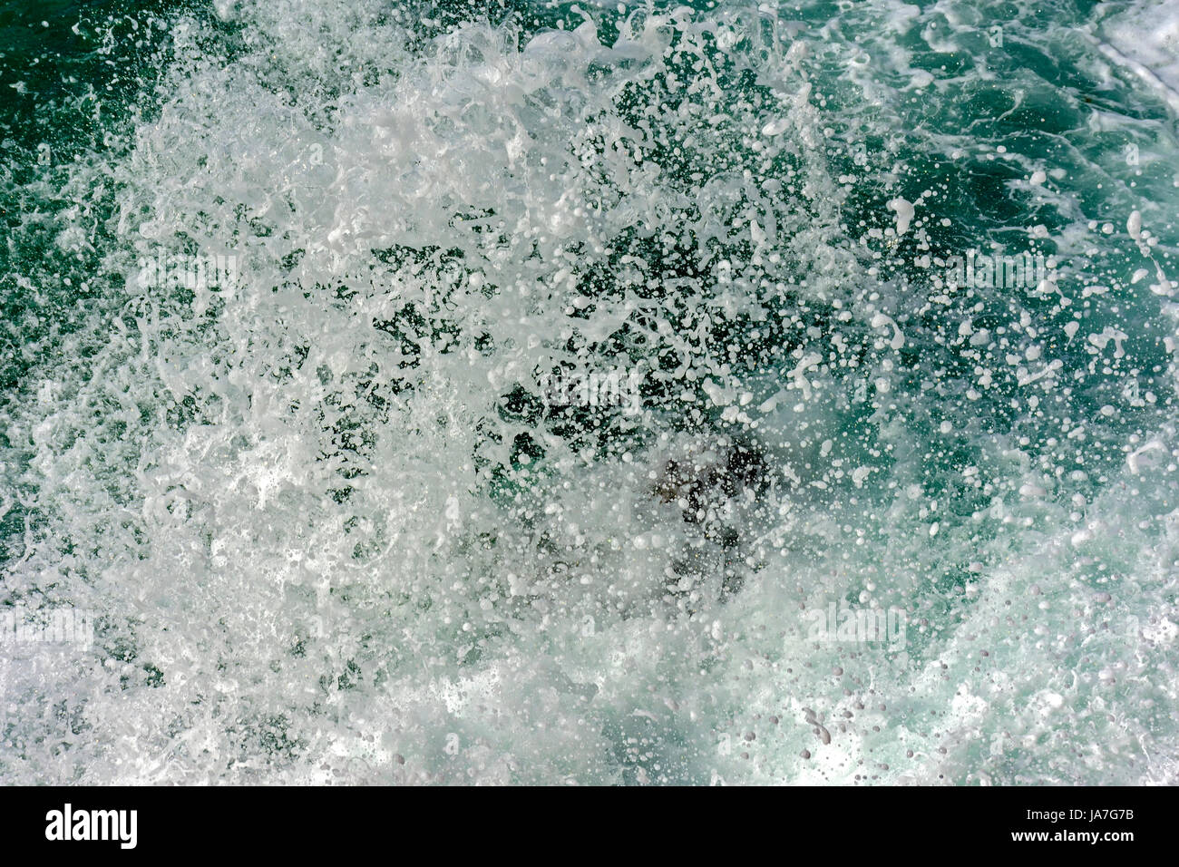 Sea water crashing against rocks during storm Stock Photo - Alamy
