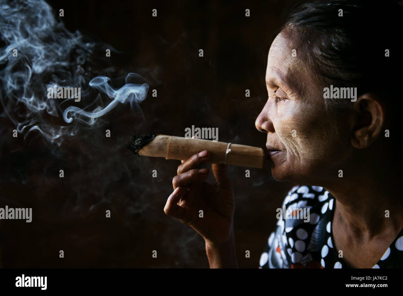 Woman smoking large cigar hi-res stock photography and images - Alamy