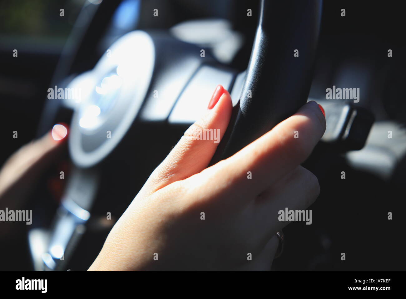 Woman driving background. Woman hands with red nails on steering wheel ...