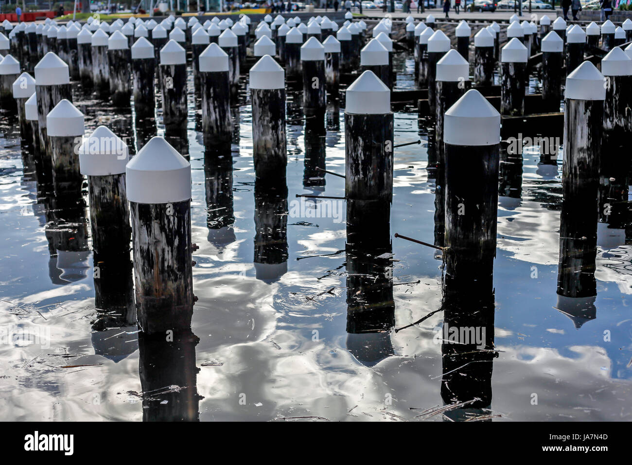 Wooden Pylon by the docks Stock Photo - Alamy