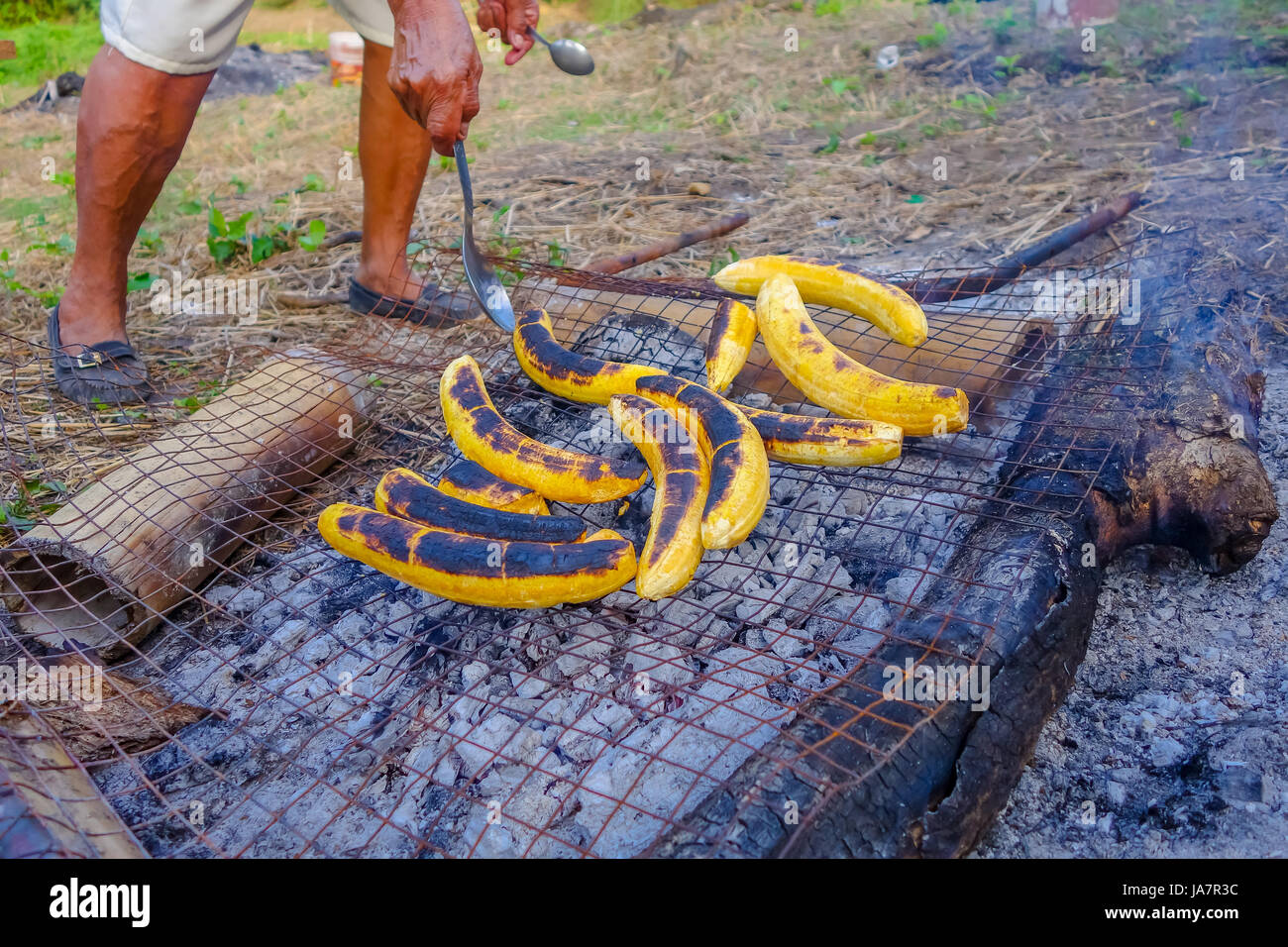 Grilled plantains in outdoors using coal to prepare it Stock Photo - Alamy