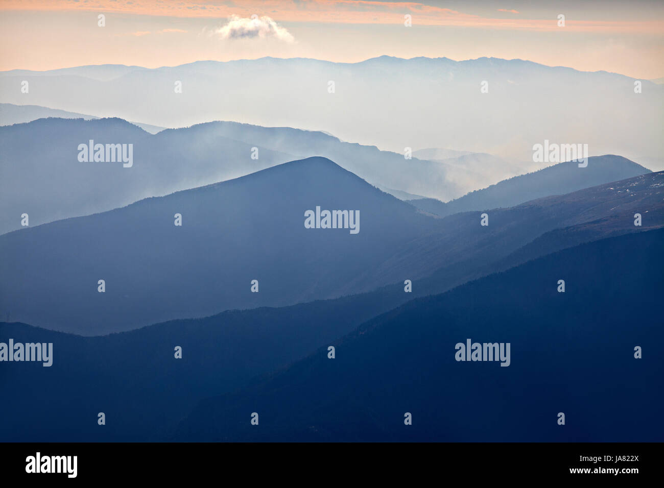 High mountain landscape in hazy weather Stock Photo - Alamy