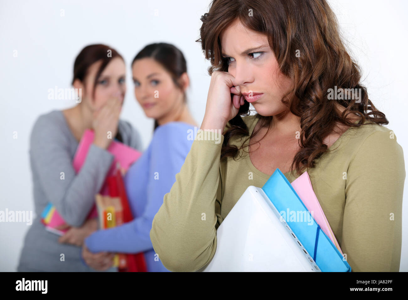 Girls criticizing another girl Stock Photo - Alamy