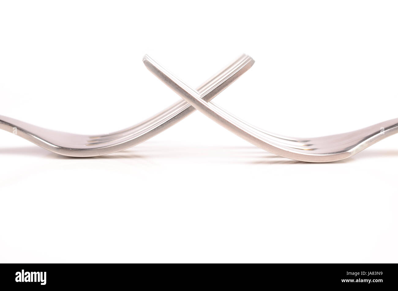 two forks on white Stock Photo - Alamy