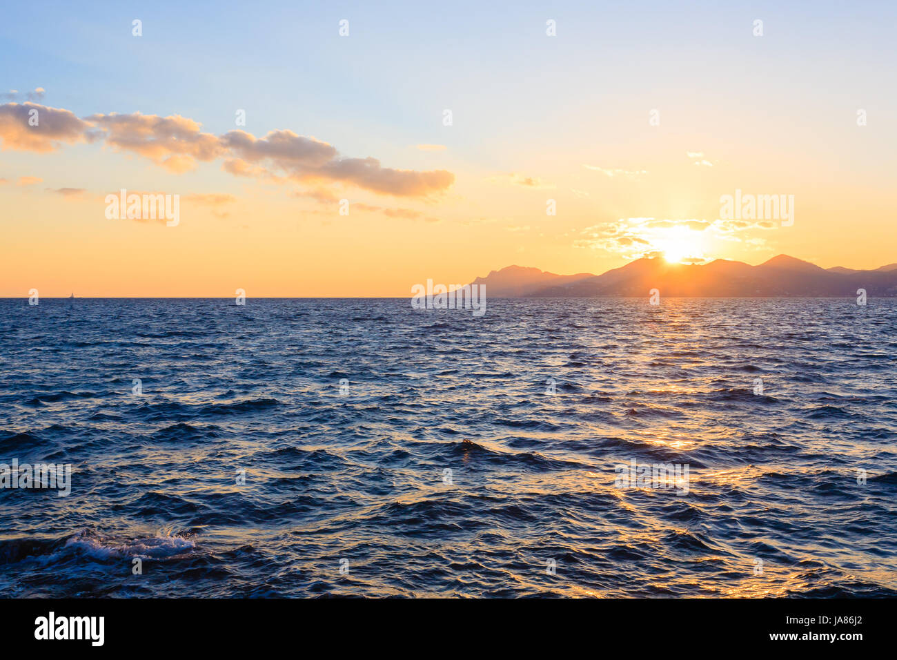 Sunset from the port of Cannes, France. Beautiful french panorama. Sun ...