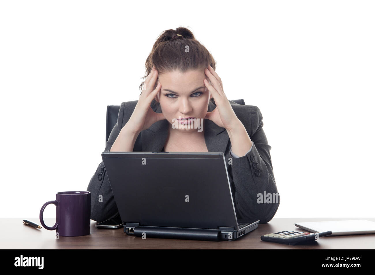 business woman stressed out at her desk unhappy in her work Stock Photo ...