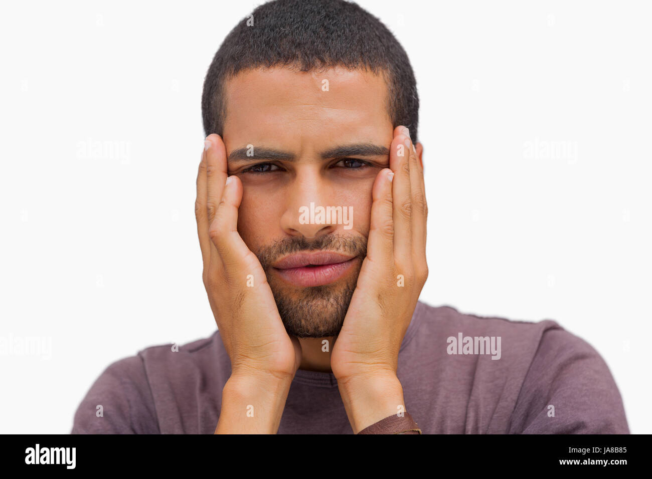 Handsome man with hands on face on white background Stock Photo - Alamy