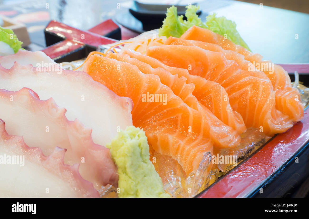 giant tentacles squid and salmon sashimi, Japanese food Stock Photo - Alamy