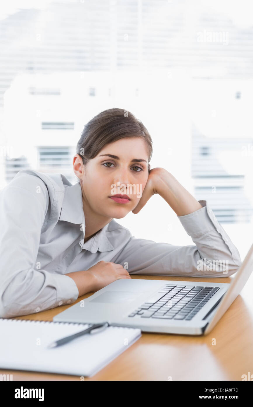 Woman slumped at her desk hi-res stock photography and images - Alamy
