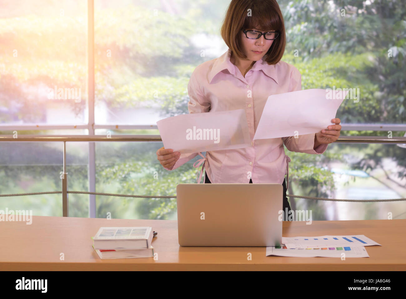 Women are planning with a laptop tablet at the desk Stock Photo - Alamy