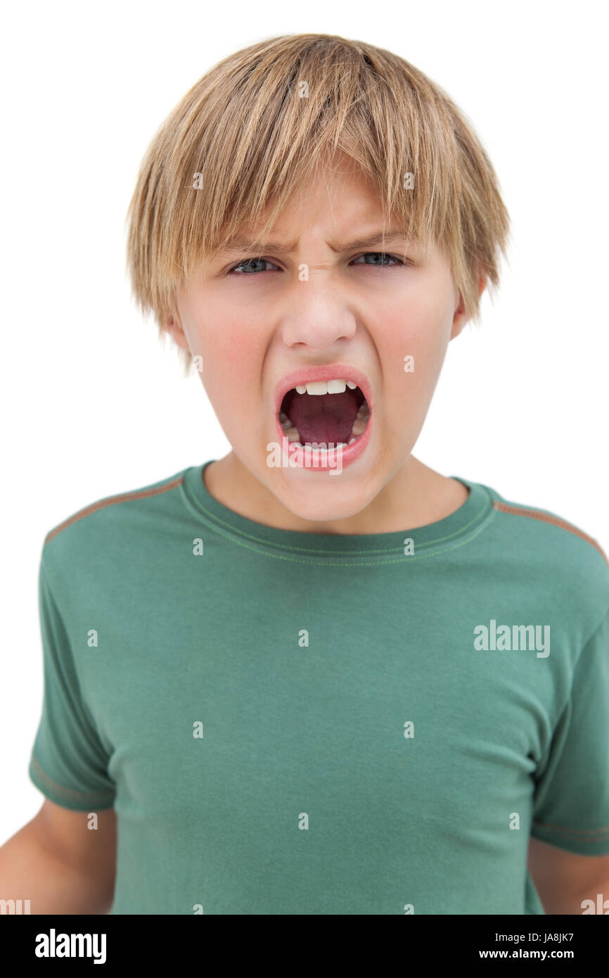 Furious little boy shouting on white background Stock Photo - Alamy