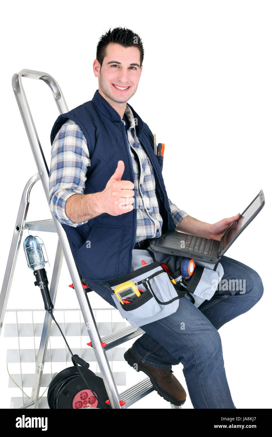 handyman with tools and a computer Stock Photo - Alamy