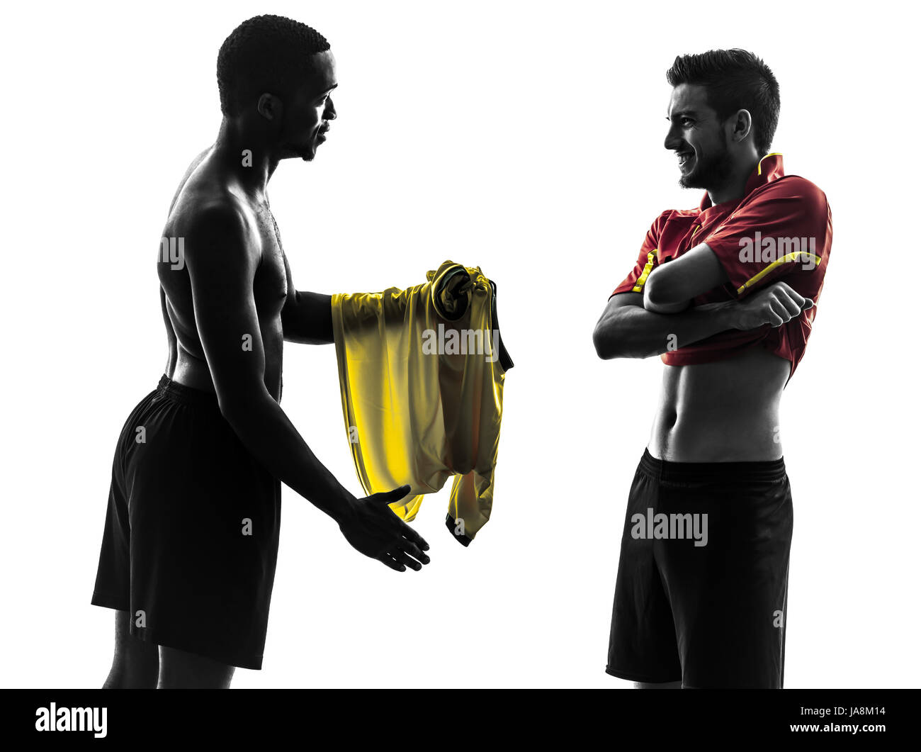 two men soccer player playing football competition exchanging jersey in ...