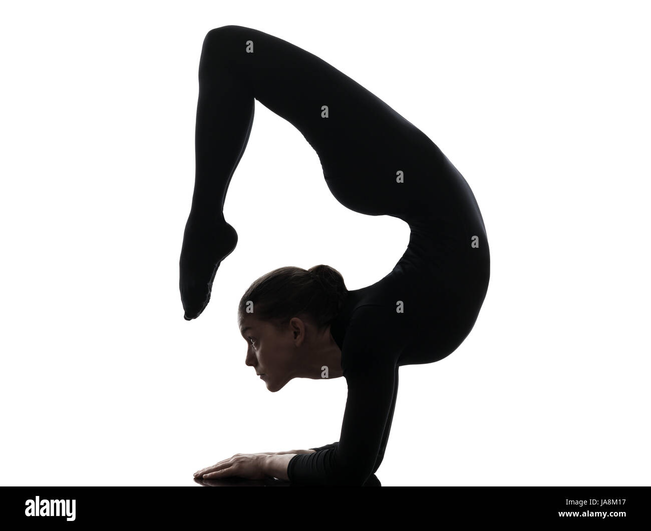 one caucasian woman contortionist practicing gymnastic yoga in ...
