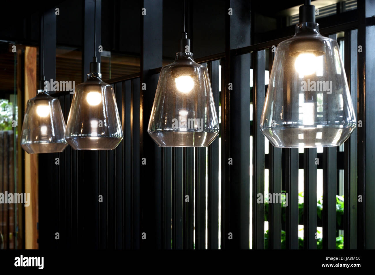 modern hanging lamp with light on ceiling Stock Photo - Alamy