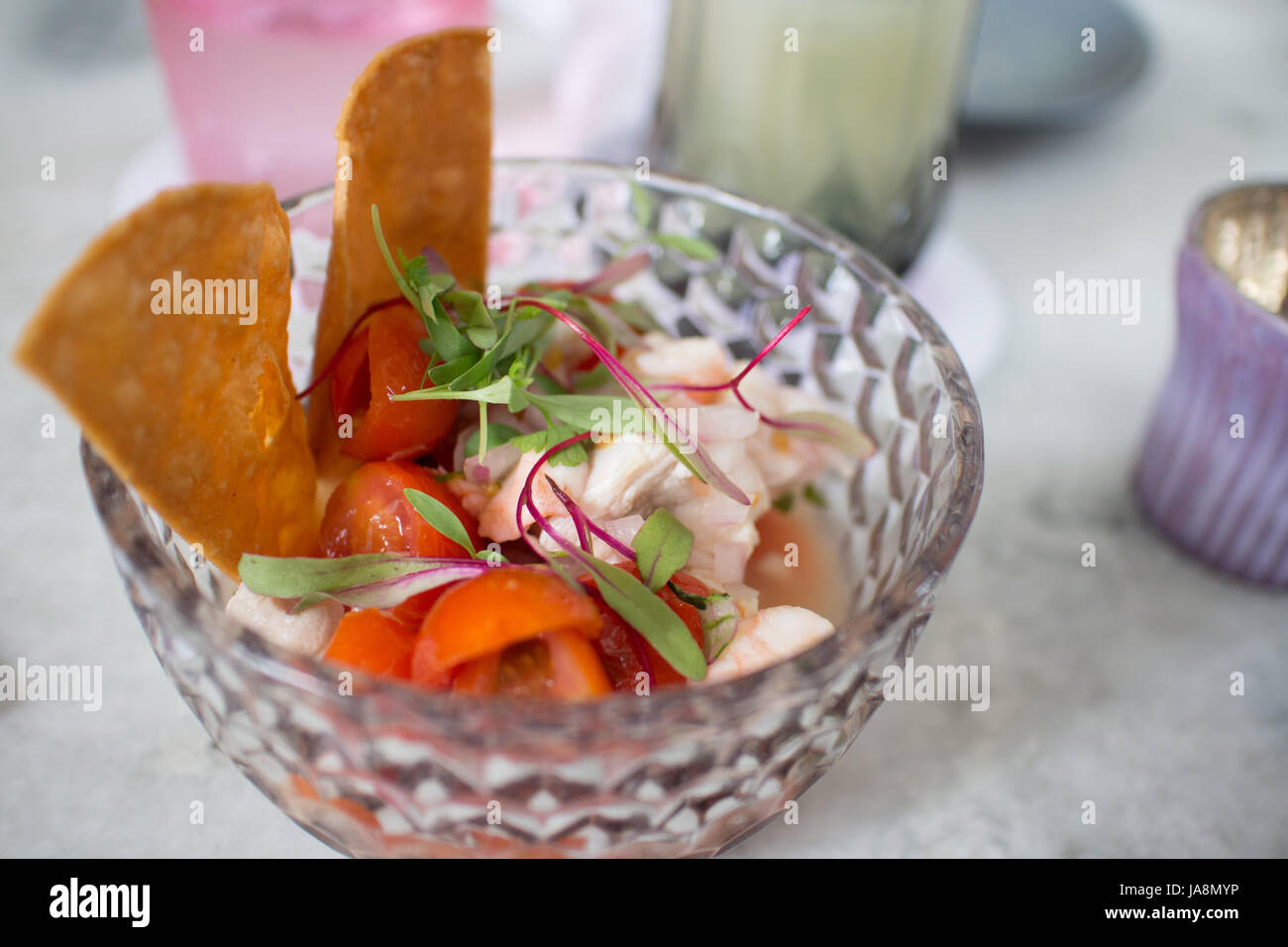 Mexican-style ceviche in a glass bowl Stock Photo - Alamy