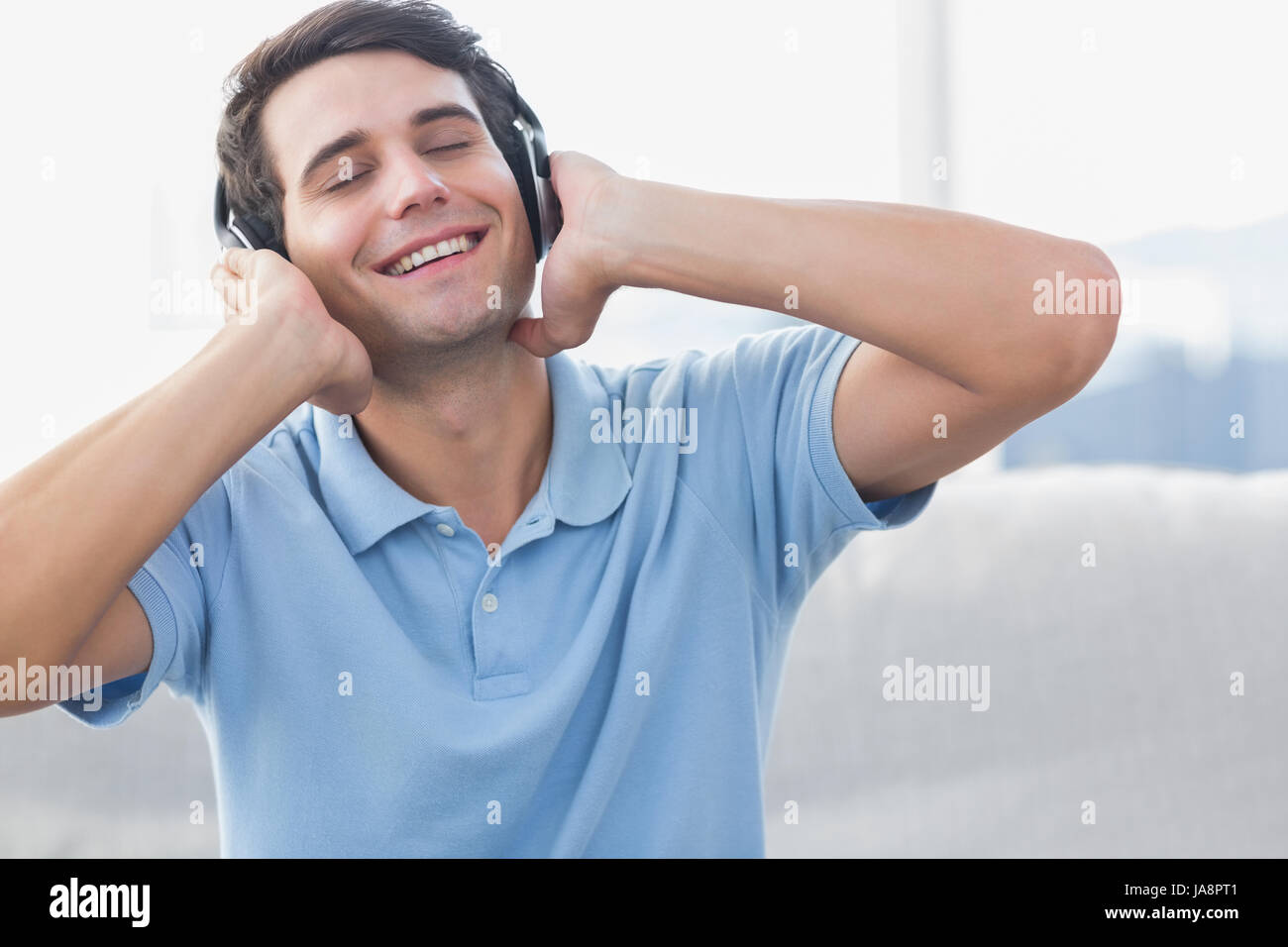 Man enjoying music with headphones Stock Photo - Alamy